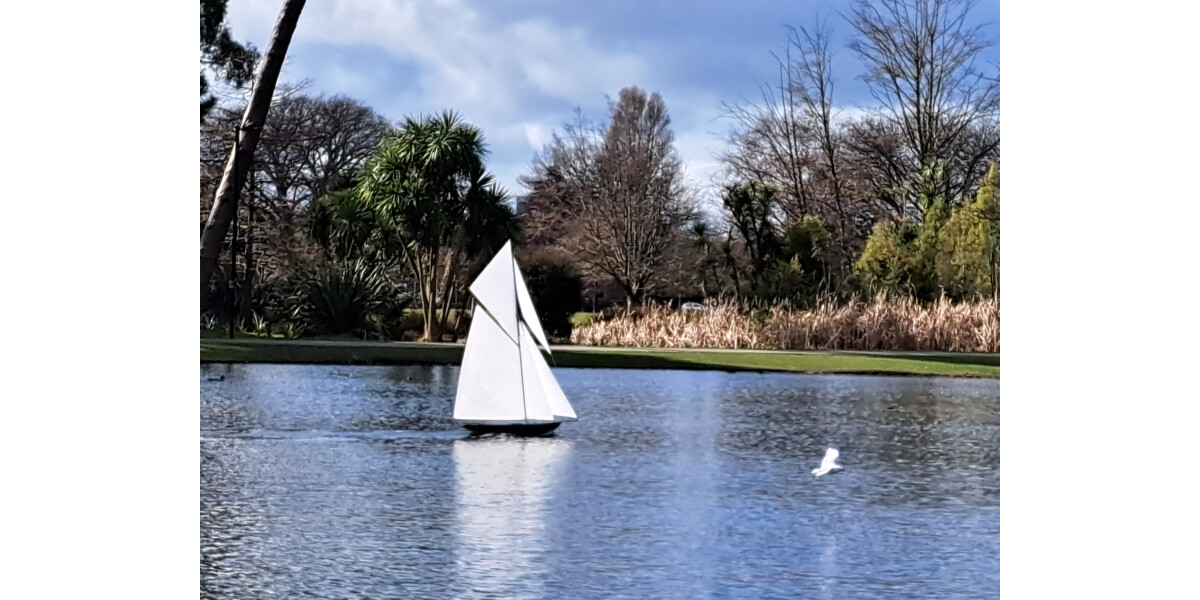 Model yacht sailing on Victoria Lake | discoverywall.nz
