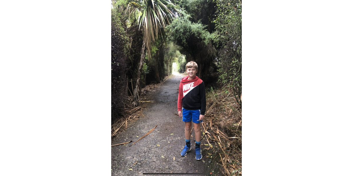 Riley walking the Travis Wetlands track | discoverywall.nz