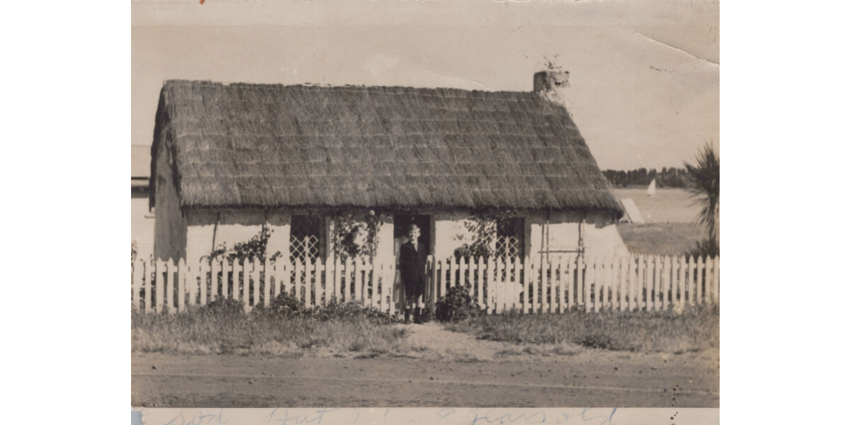 Peter Stuart standing outside the Sod Hut | discoverywall.nz