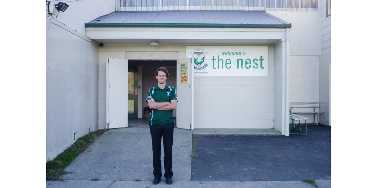 Halswell hawks player outside the clubrooms | discoverywall.nz